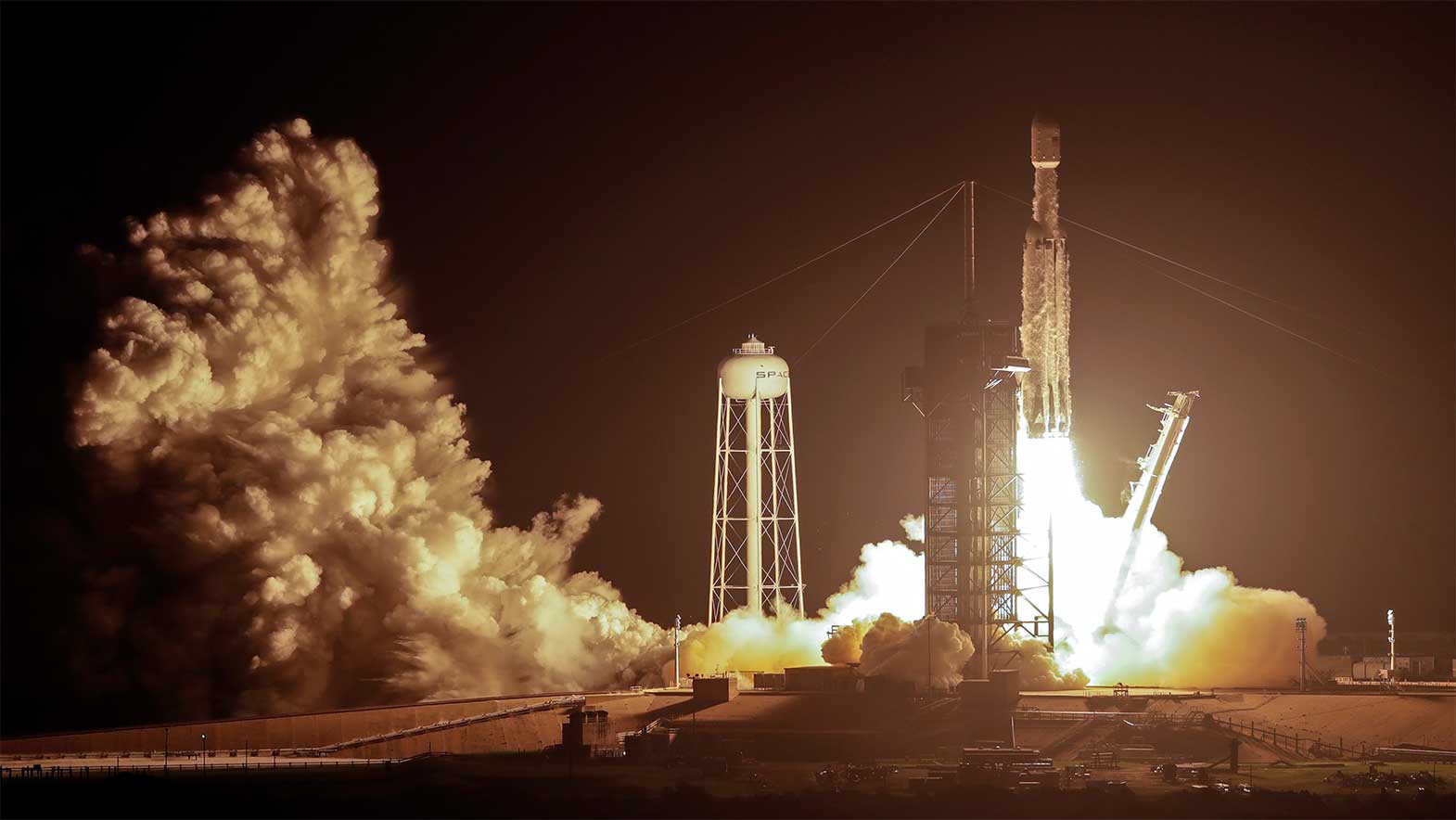 SpaceX Launches 24 Satellites and an Atomic Clock Into in Space