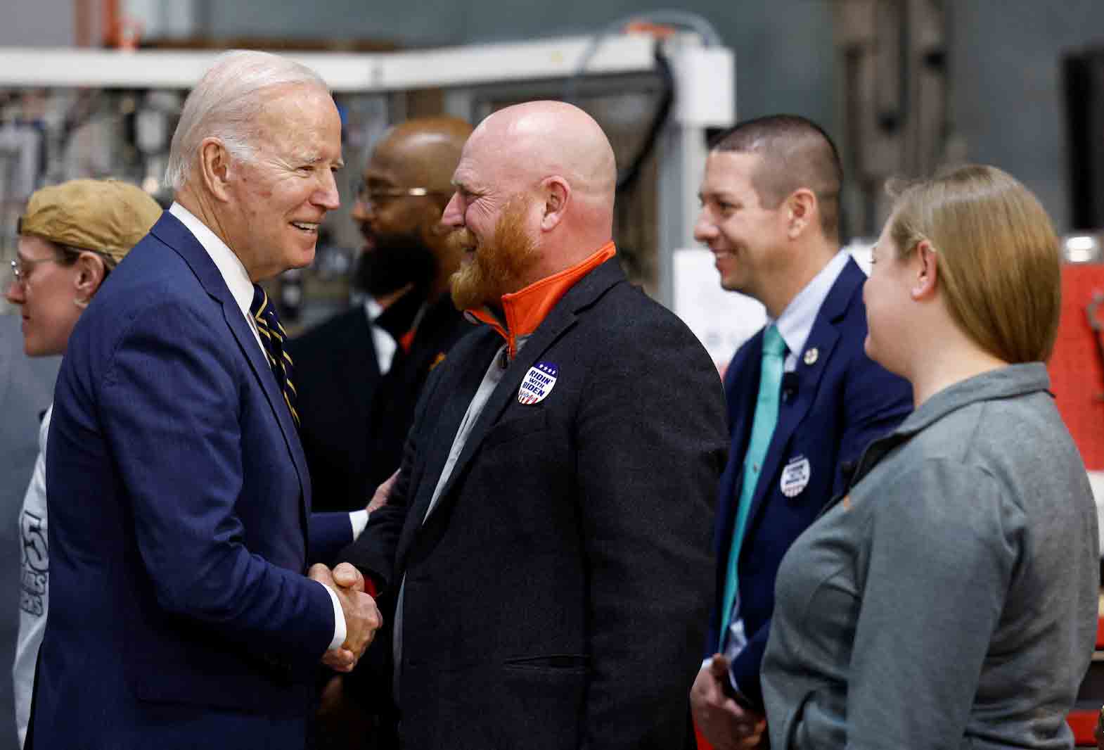 Biden approval rises, bolstered by support from Democrats - Reuters ...